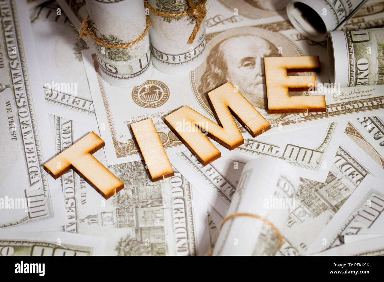 Time is money, dollar bills and time text Stock Photo - Alamy