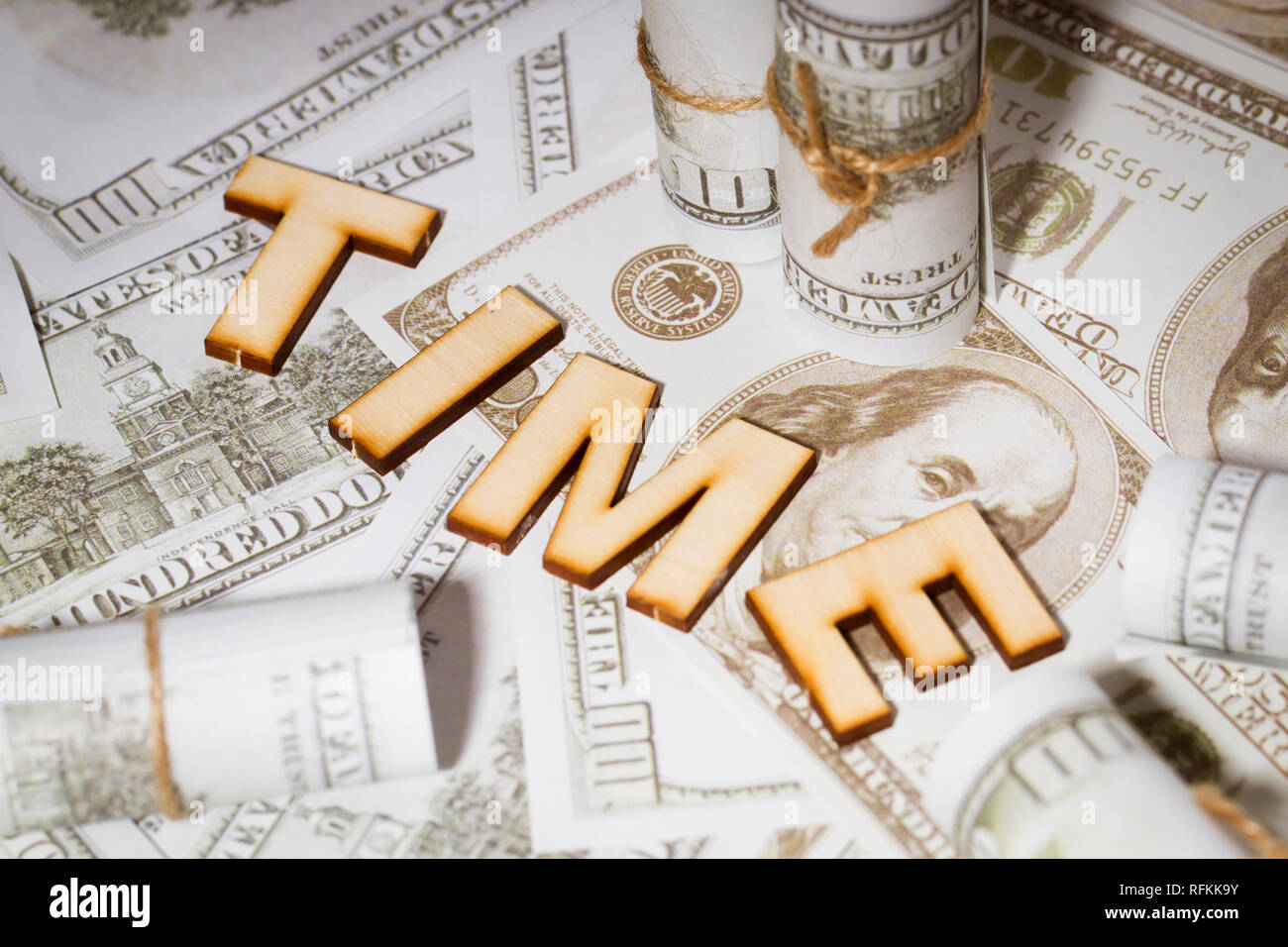 Time is money, dollar bills and time text Stock Photo - Alamy