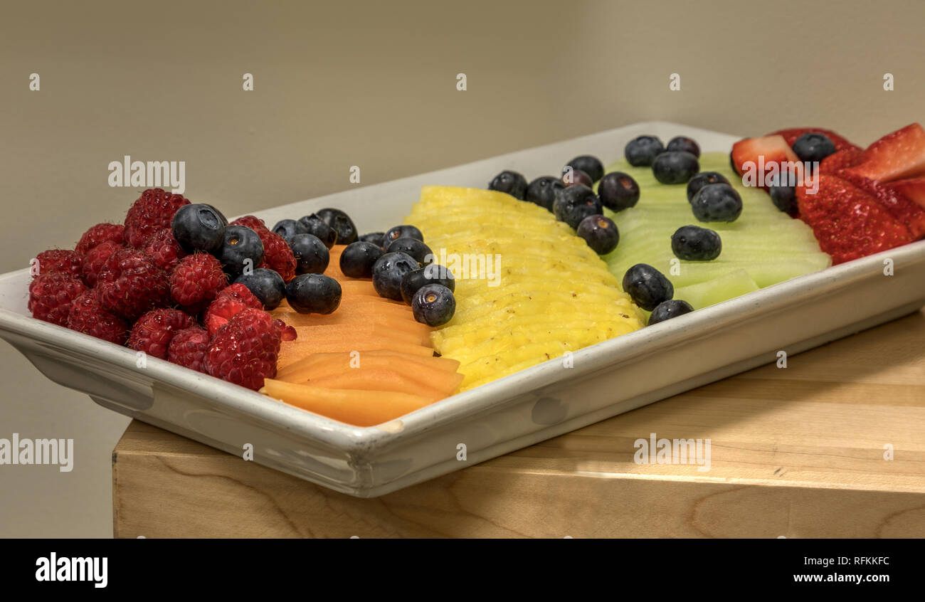 Fruit platter including raspberries, pineapple, blueberries, cantaloupe ...