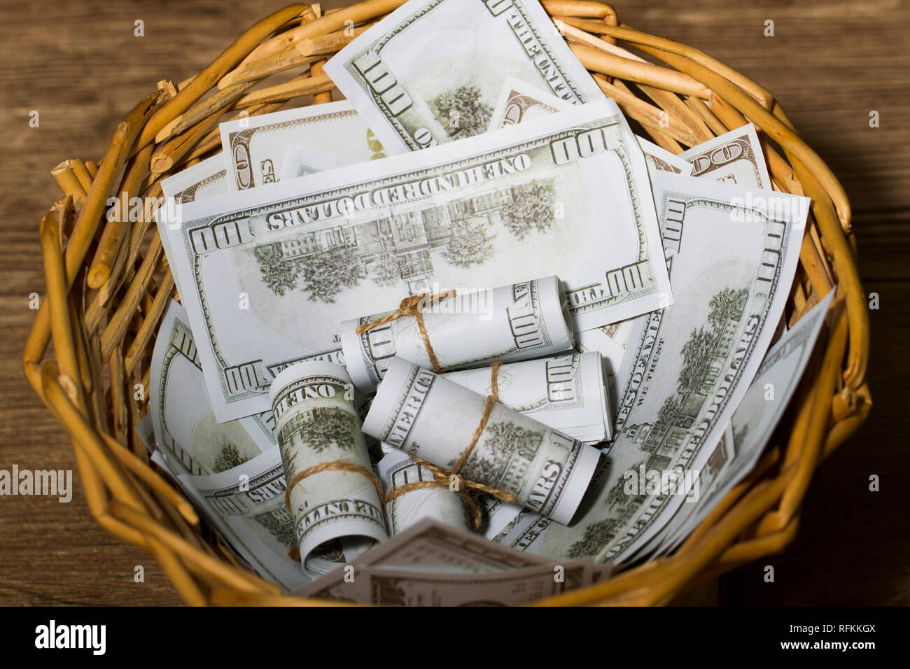 Dollar bills inside the basket Stock Photo - Alamy