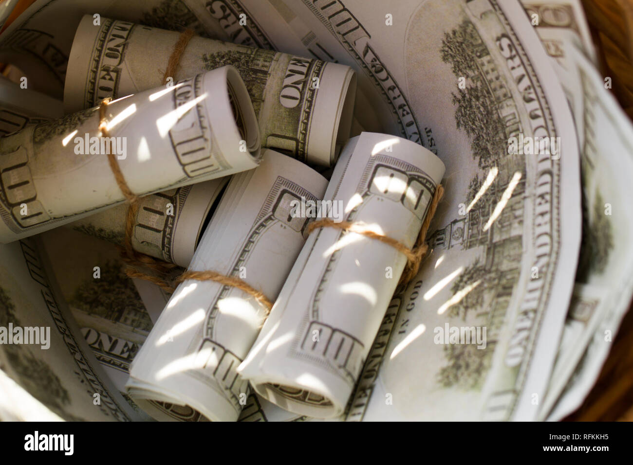 Dollar bills inside the basket Stock Photo - Alamy