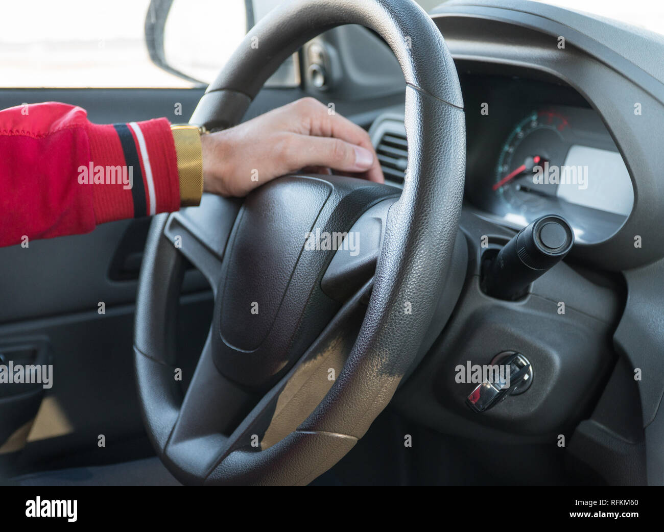 men's hand with a watch on the steering wheel of a modern car Stock ...