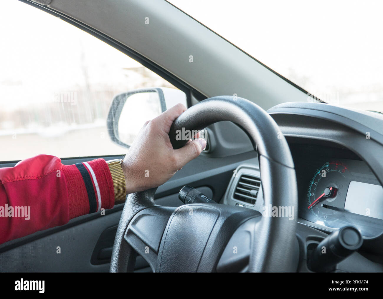 men's hand with a watch on the steering wheel of a modern car Stock ...