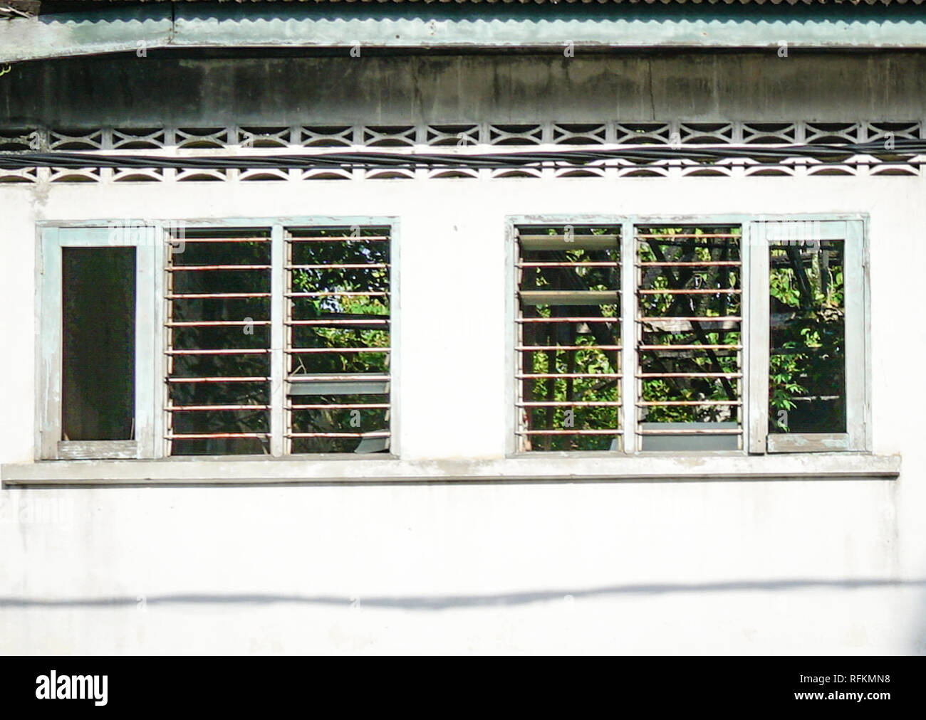 Old vintage Asian windows in Malaysia Stock Photo - Alamy