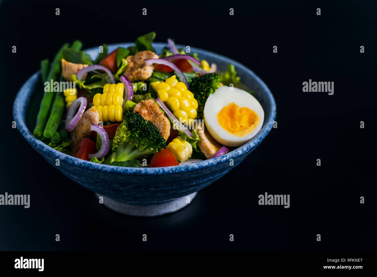 Fresh chicken veggie salad with corn and egg Stock Photo - Alamy