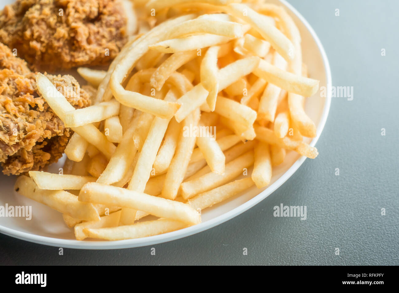 French fries and Fried chicken - Junk food style Stock Photo - Alamy