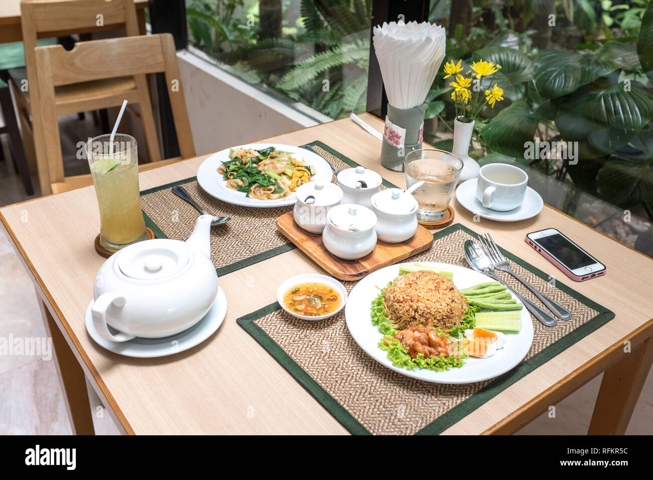 Table setting with meals for two Stock Photo - Alamy