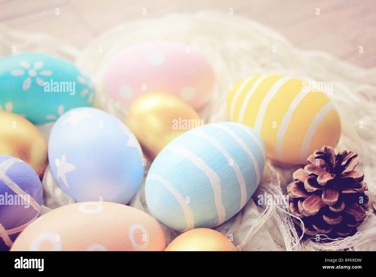 Pastel easter eggs on cloth with retro filter effect Stock Photo - Alamy