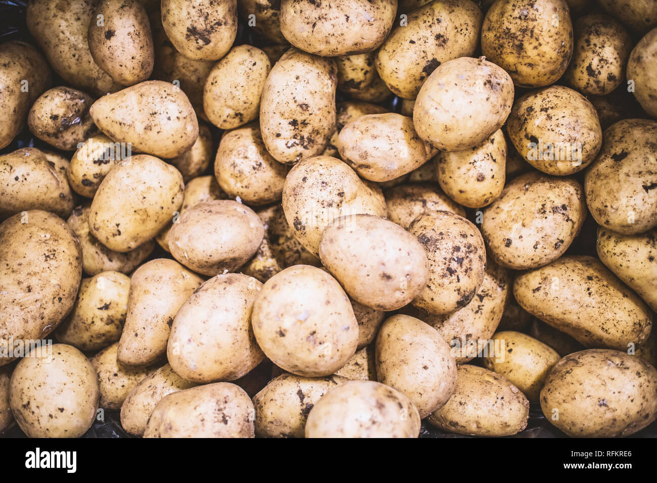 Patatoes lined on a counter of open market nice photo Stock Photo - Alamy