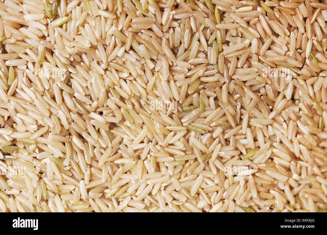 Raw Organic Rice Closeup Background Stock Photo - Alamy