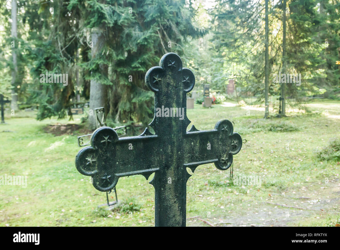 Cross at old beautiful semetery in Finland Stock Photo - Alamy