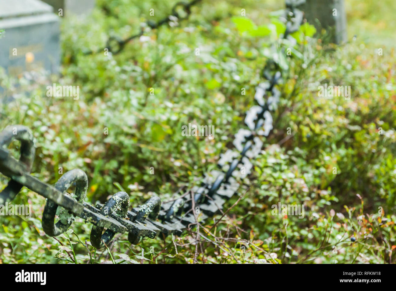 Chain at old beautiful semetery in Finland Stock Photo - Alamy