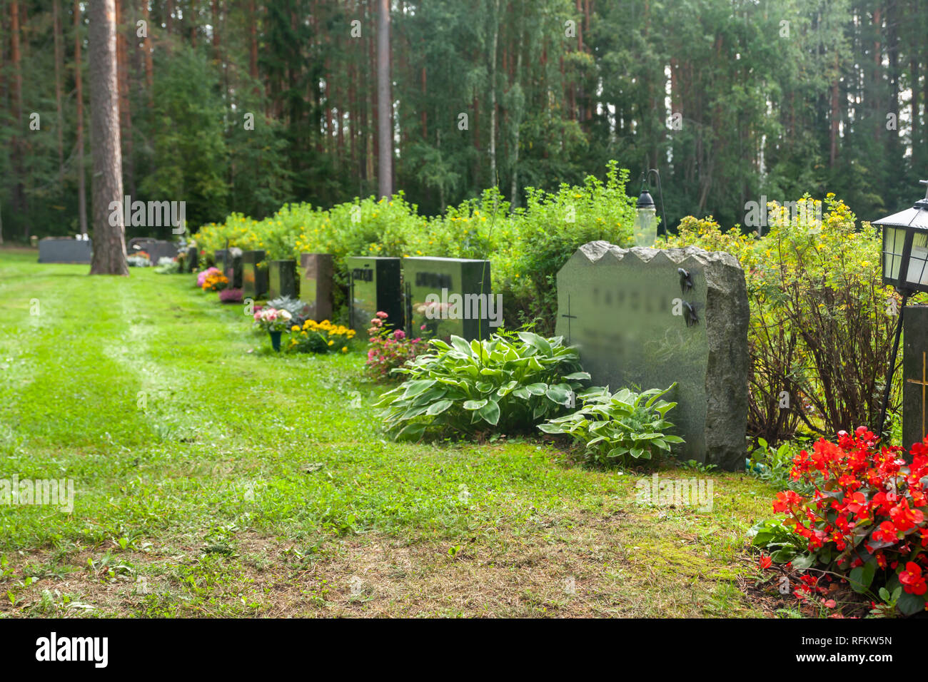 Cemetery with gravestones and flowers in Finland Stock Photo - Alamy