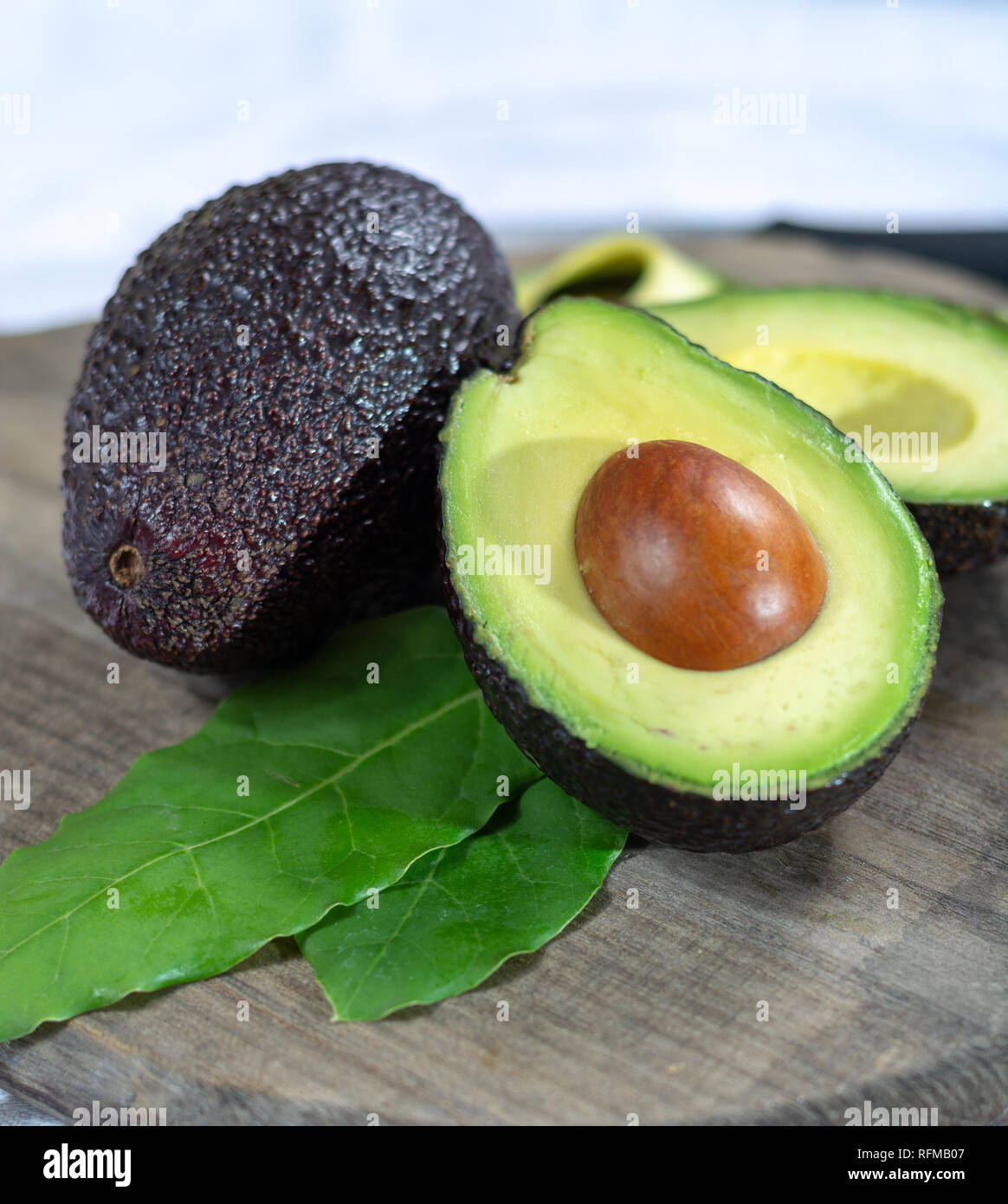Two fresh ripe raw hass avocados, close up, healthy food concept Stock ...