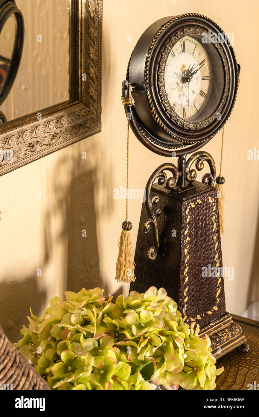 Interior decor arrangement with mirror, clock, vase and floral Stock ...