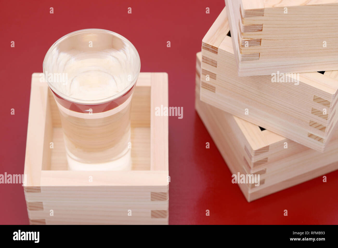 Japanese wooden box masu with sake on a wooden table background Stock ...