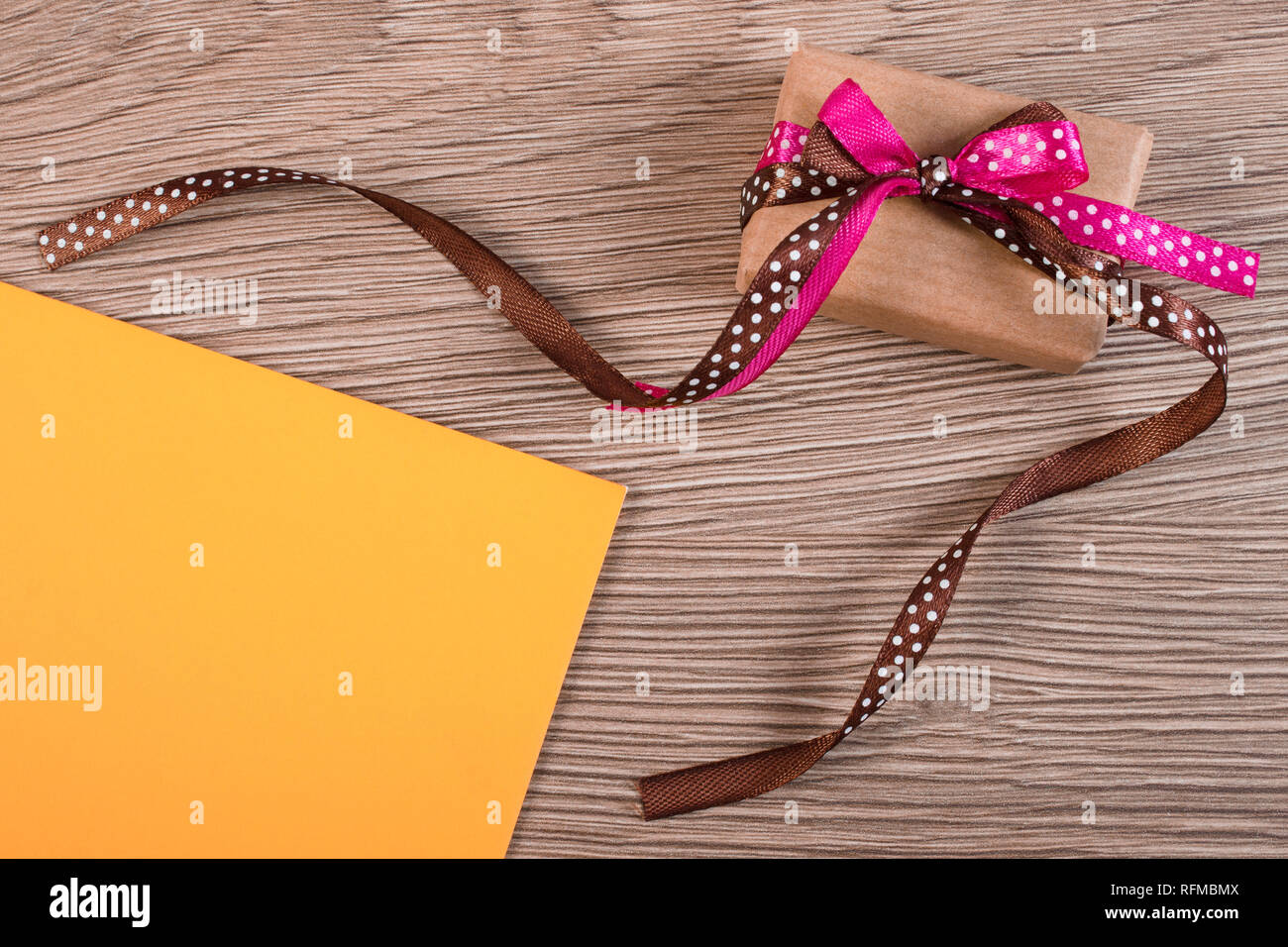 Wrapped gift with ribbon and love letter in envelope, decoration for ...