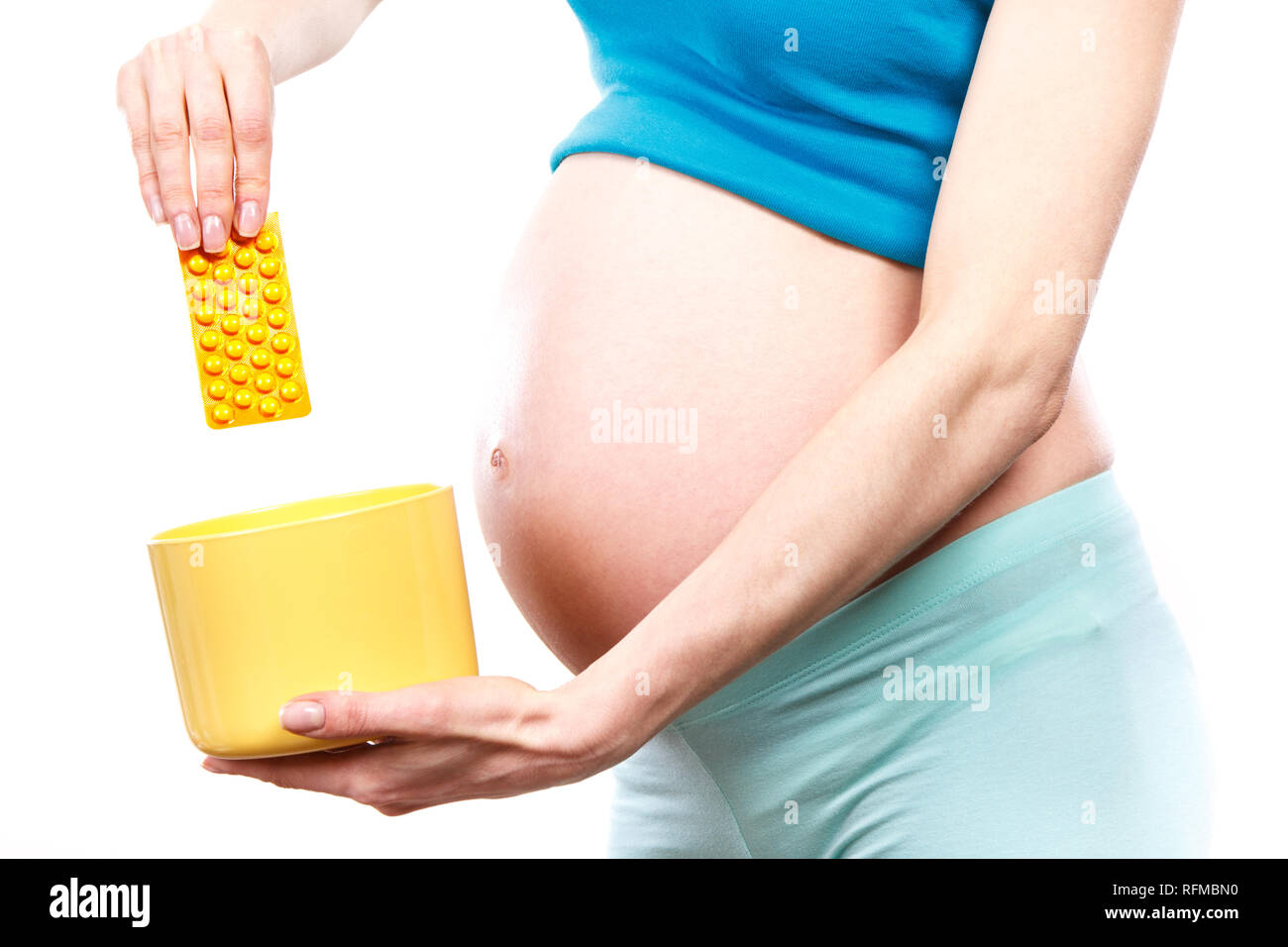 Pregnant woman throwing medical pharmaceuticals, reduction of using ...