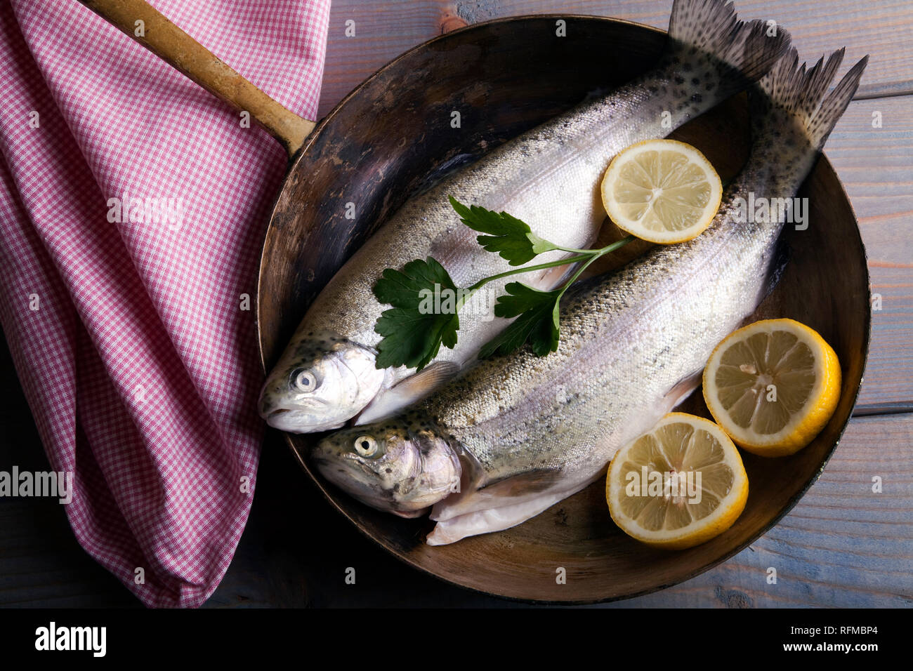 Two fresh brown trout in a pan Stock Photo - Alamy
