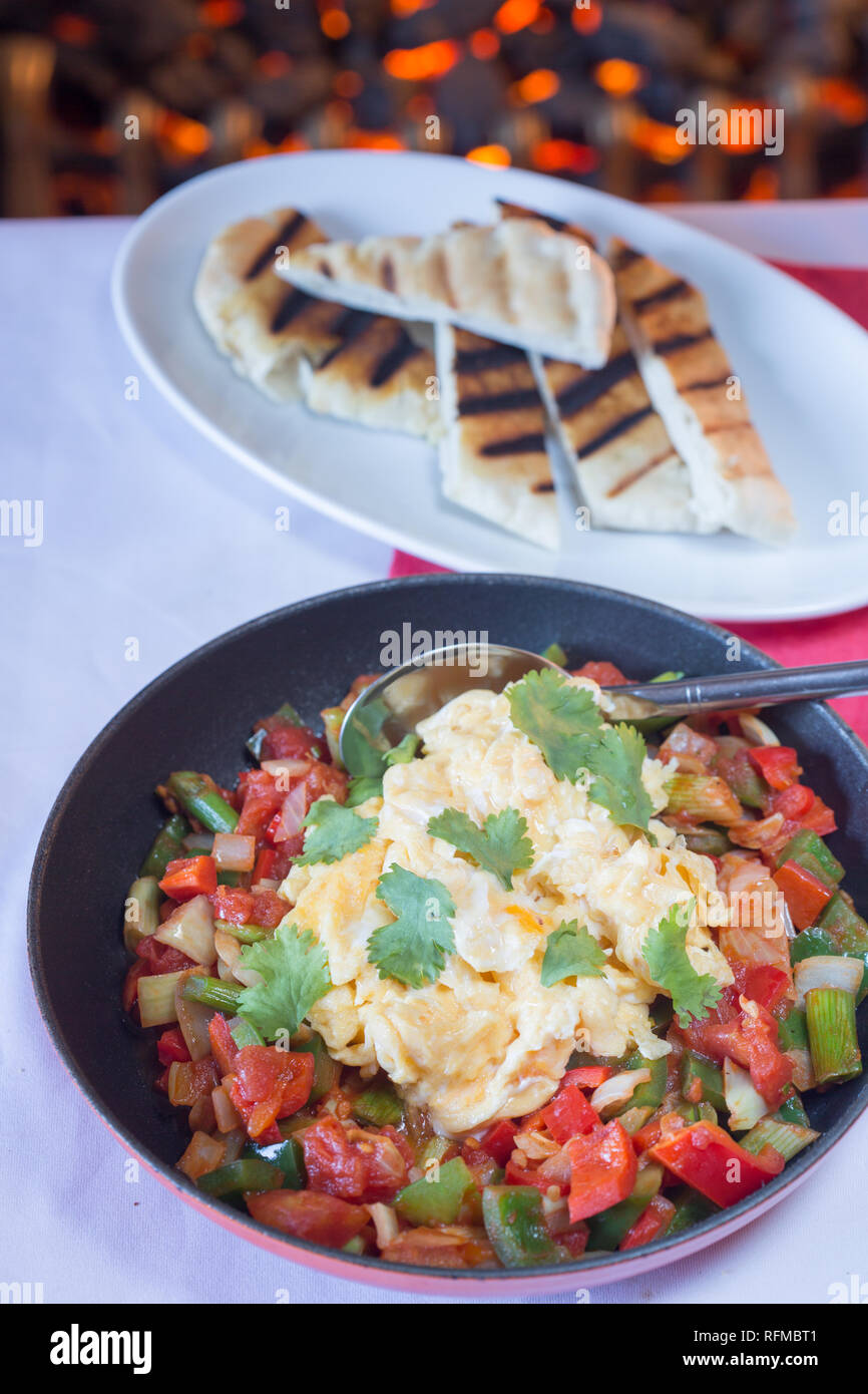 Traditional Turkish breakfast dish of Menemen with flatbread Stock ...