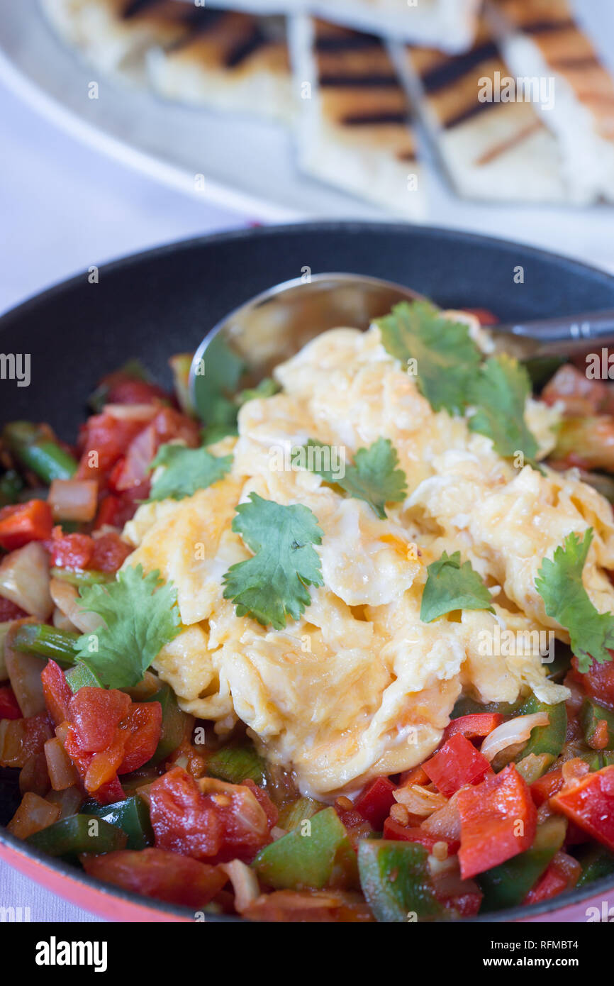 Traditional Turkish breakfast dish of Menemen with flatbread Stock ...