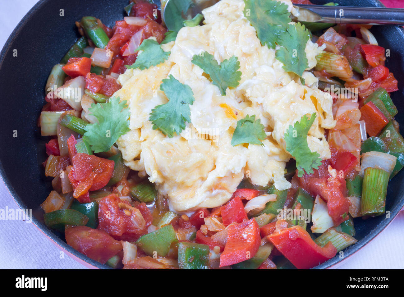Traditional Turkish breakfast dish of Menemen with flatbread Stock ...