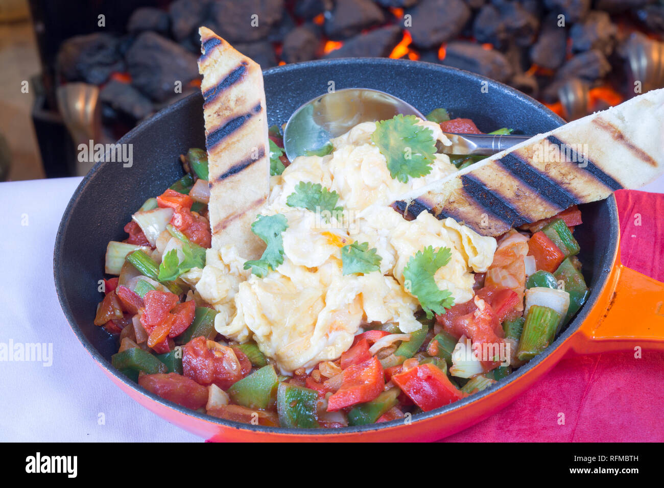 Traditional Turkish breakfast dish of Menemen with flatbread Stock ...