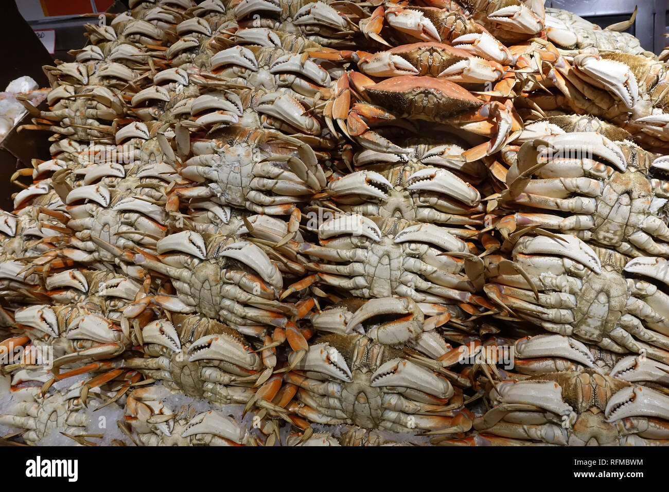 Fresh caught crabs are stacked and availed for purchase at a fish ...