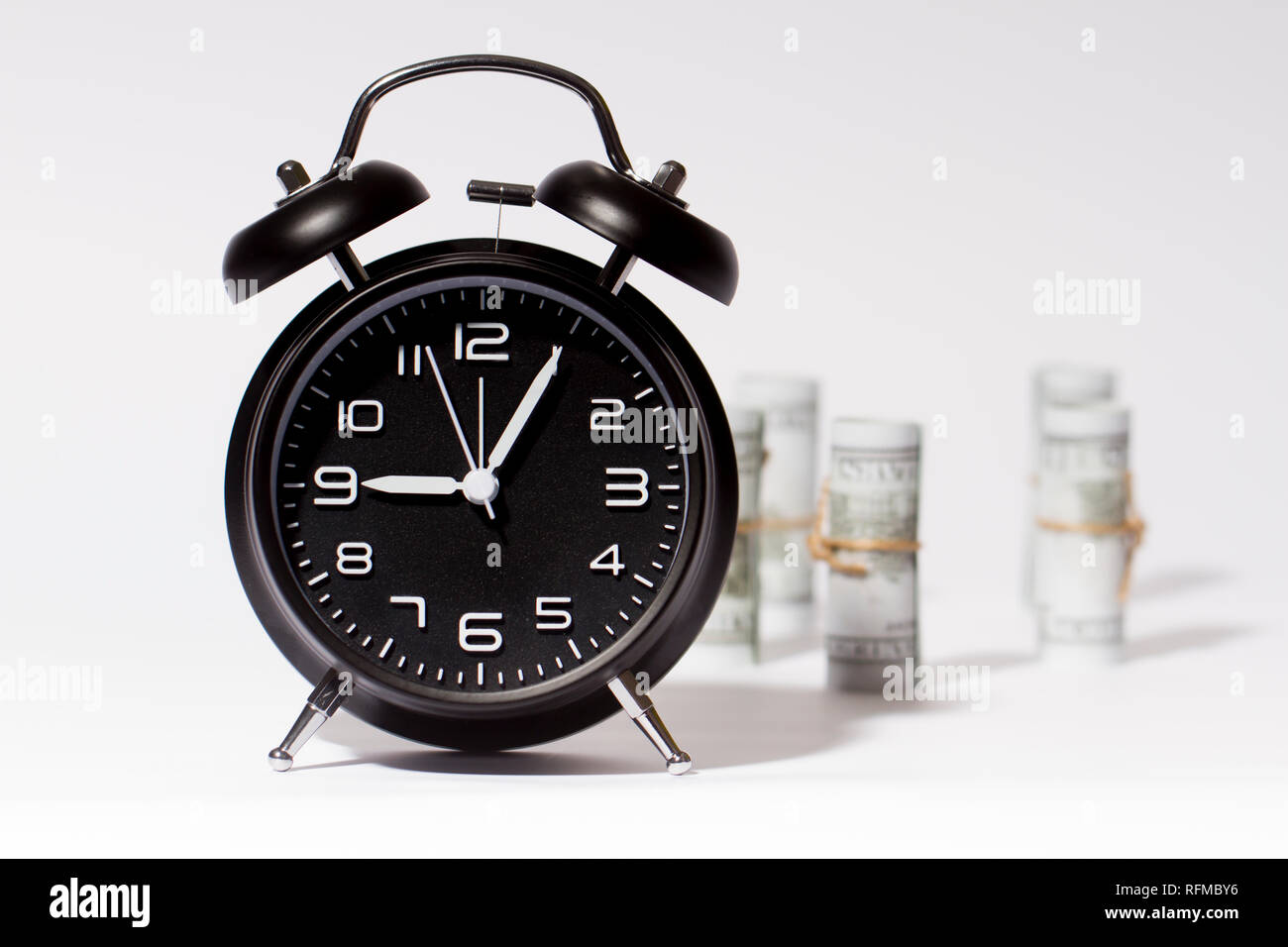 Clock and money, precious time Stock Photo - Alamy