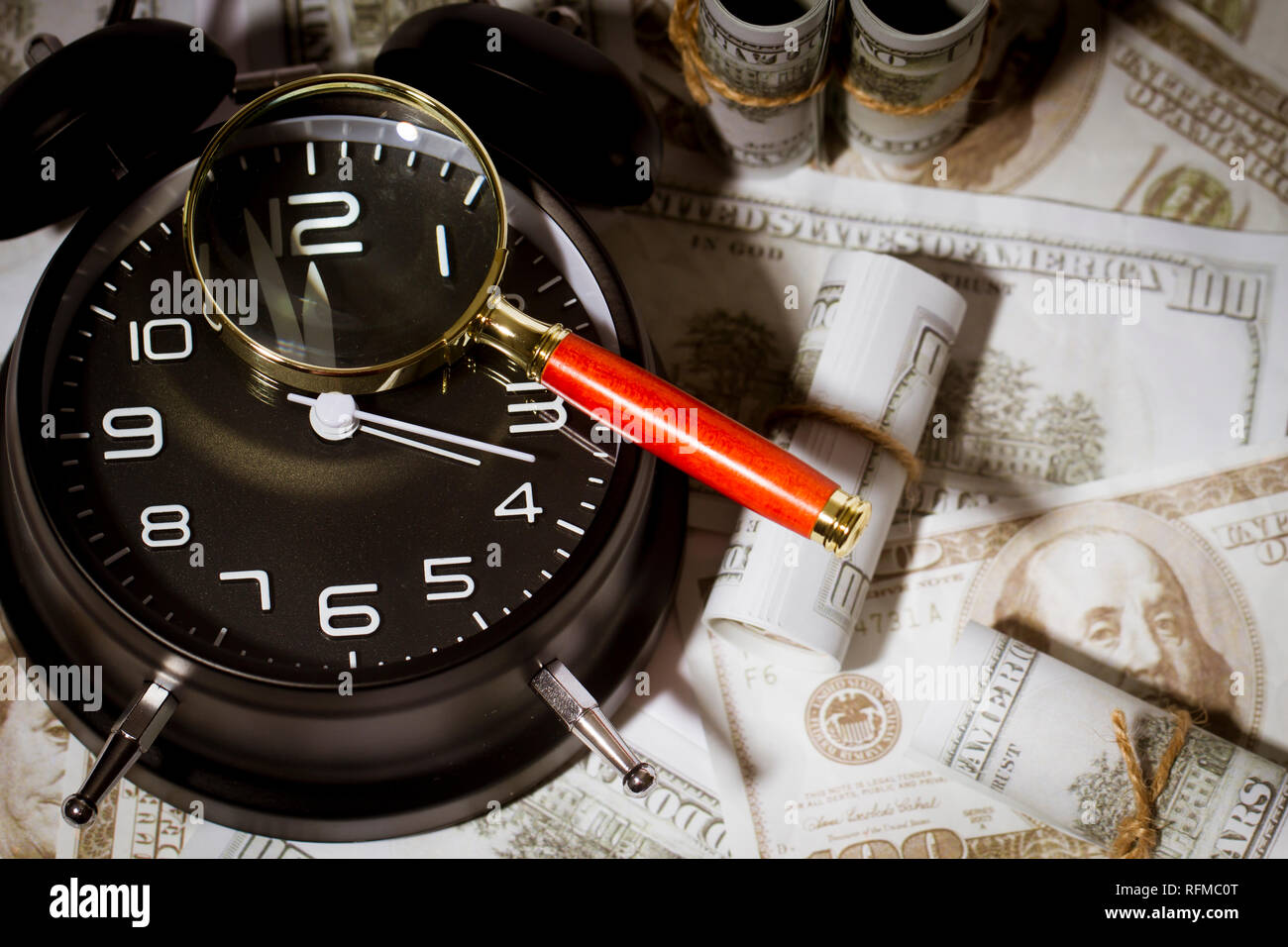 Clock and money, precious time Stock Photo - Alamy