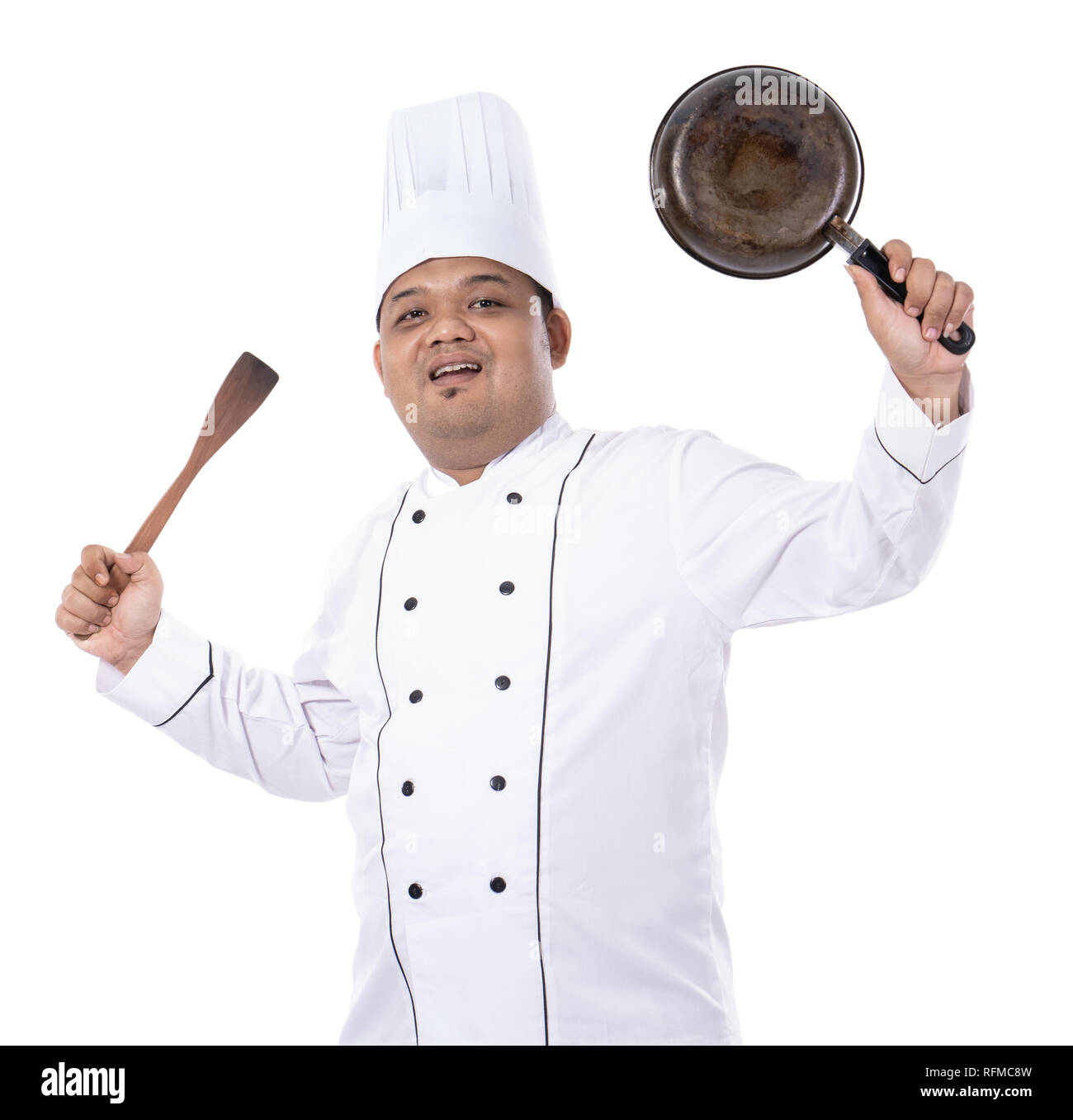images of chef confidence wit pose hands up holding pan Stock Photo - Alamy