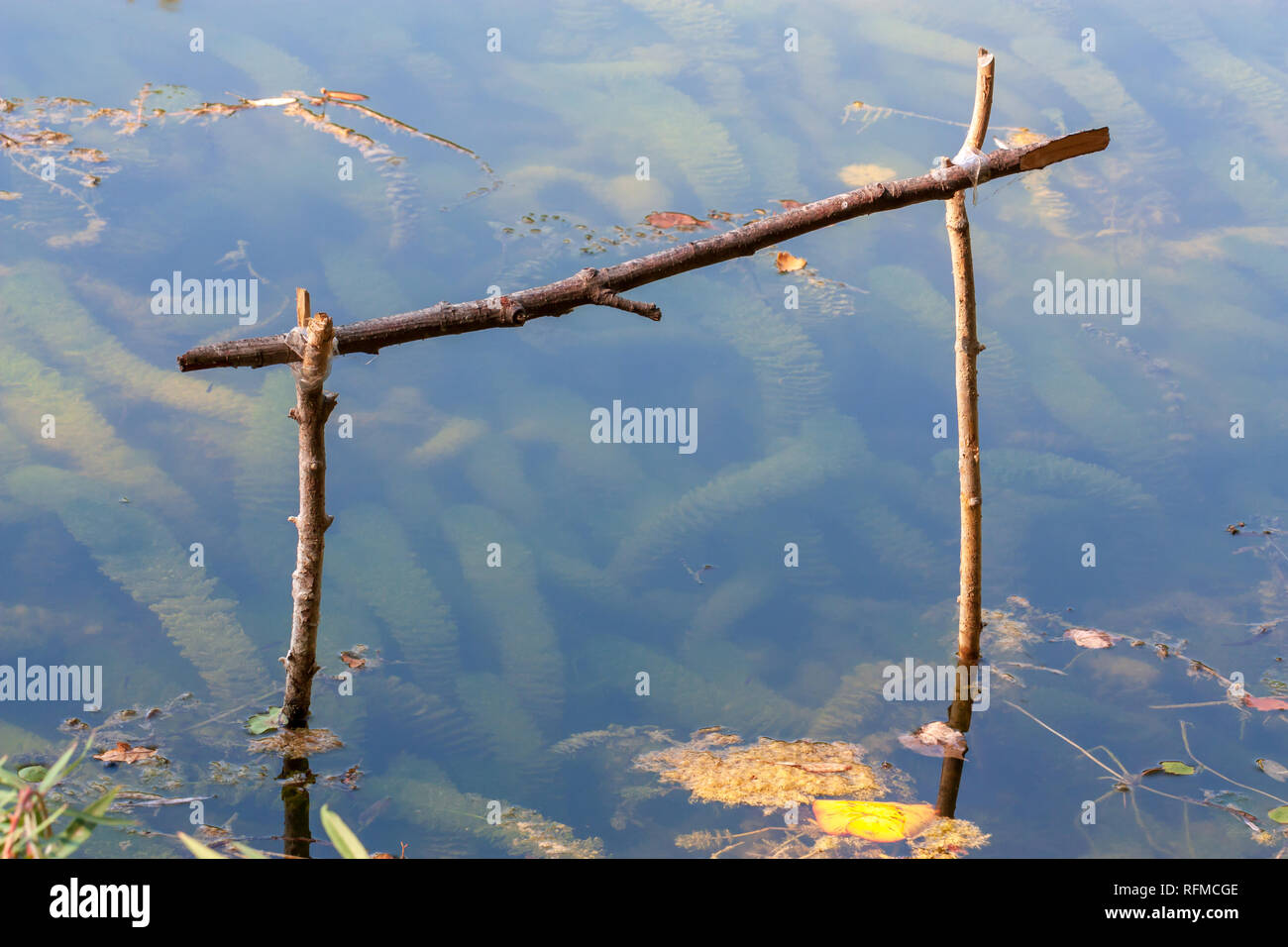 Improvised stand for fishing rods Stock Photo - Alamy
