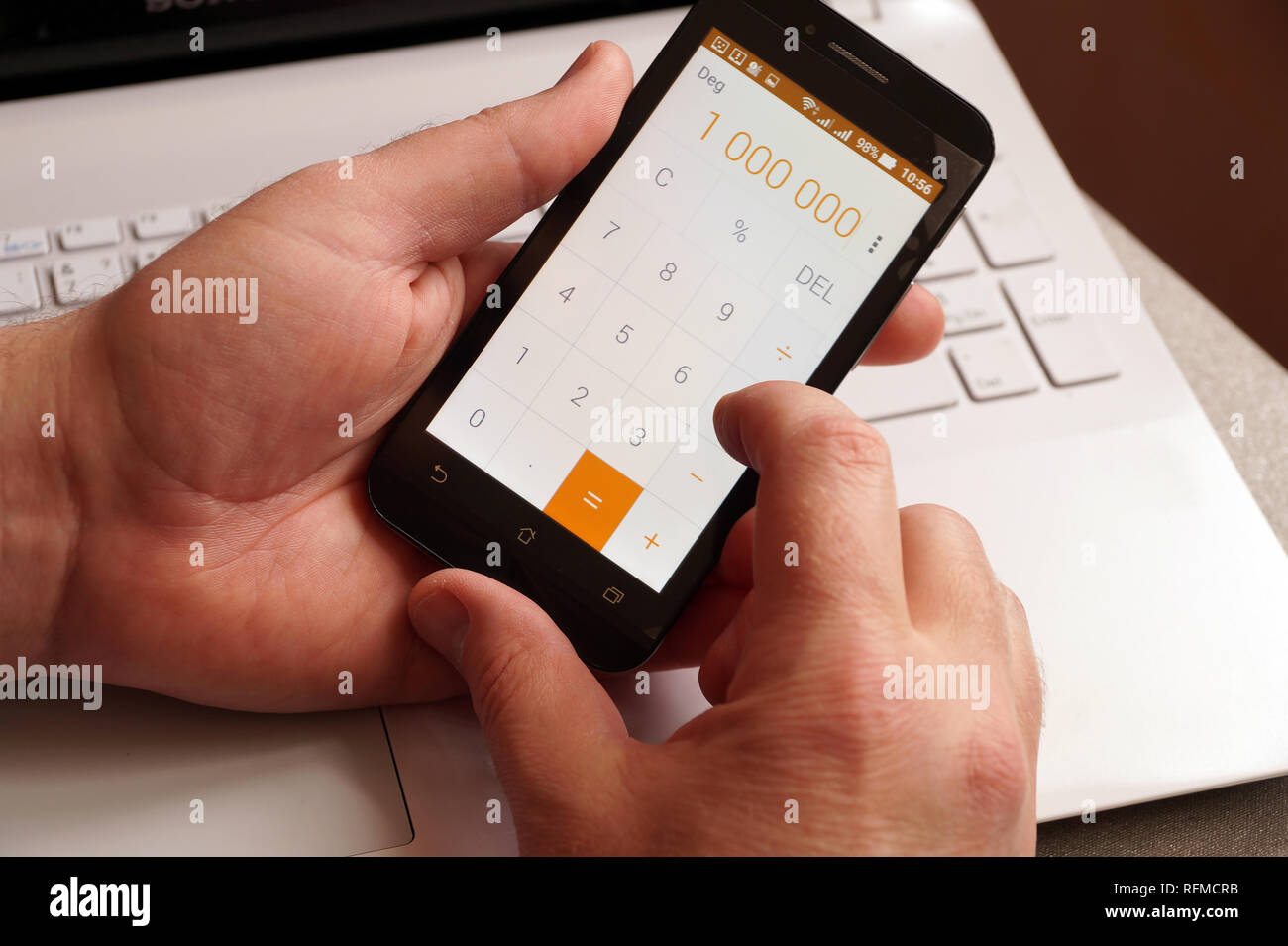 To reach one million in calculations on the calculator Stock Photo - Alamy