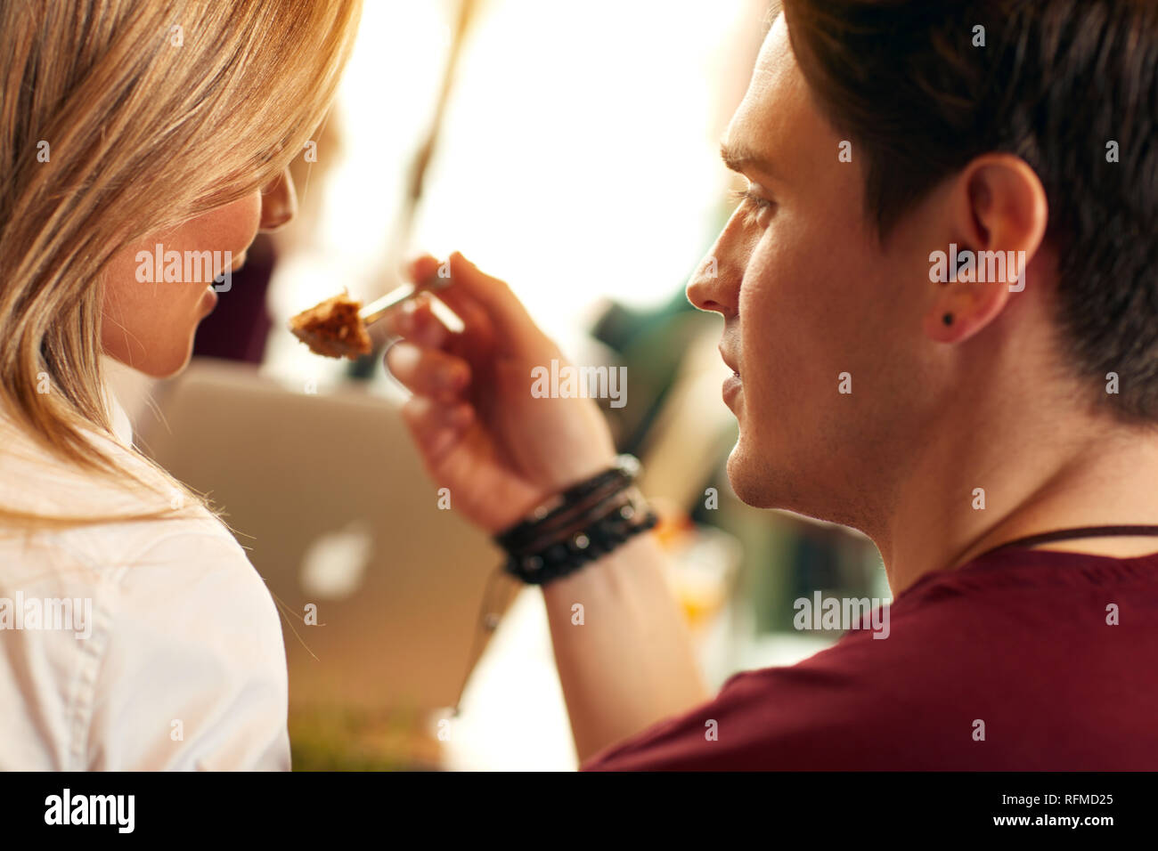 Back view of couple together when eat in restaurant Stock Photo - Alamy