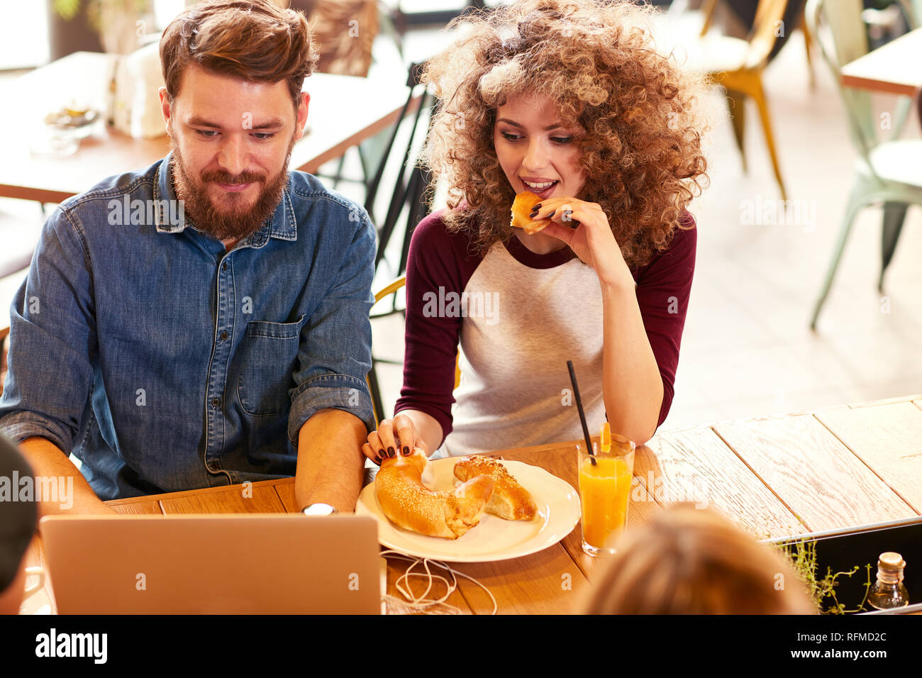 Couple having breakfast time in restaurant Stock Photo - Alamy