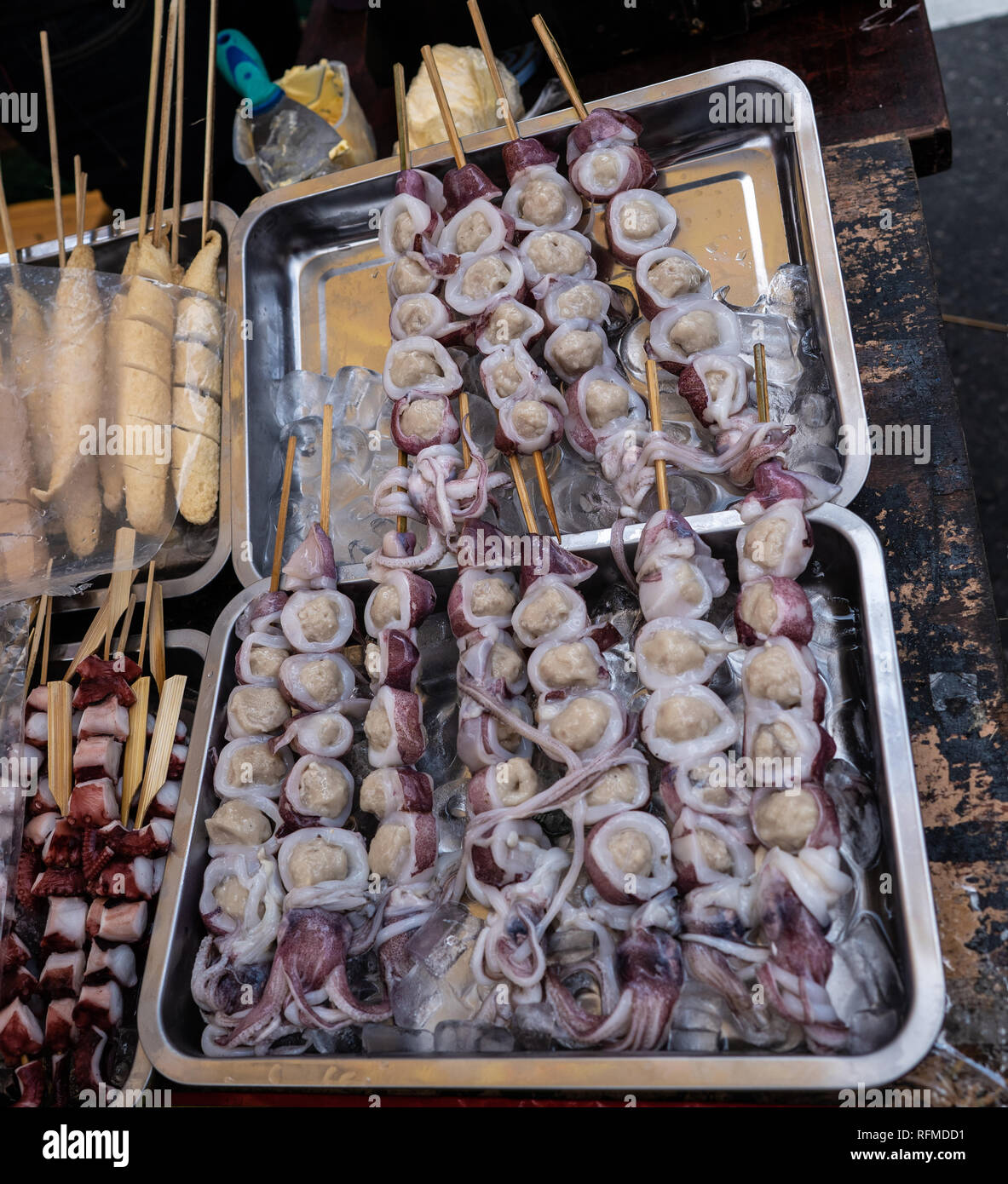 portrait of fresh cuttlefish made satay on a serving tray Stock Photo ...