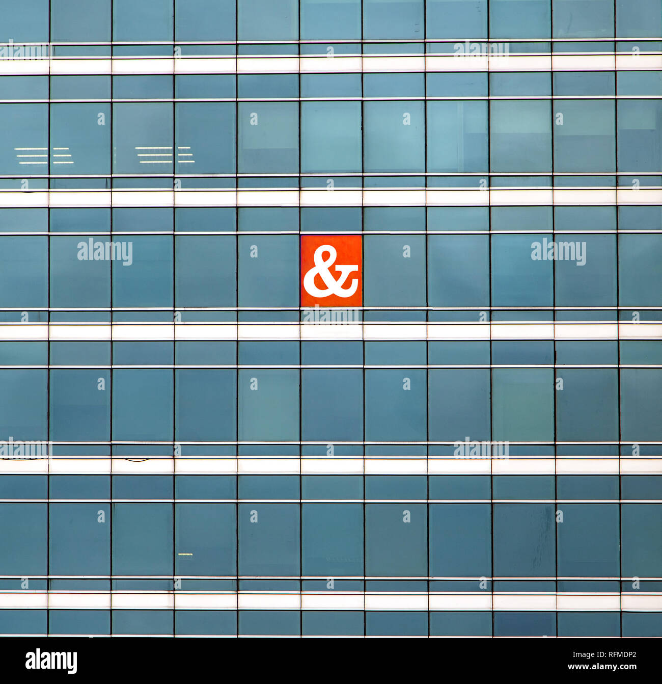 The symbol of the Ampersand on the building's window. The glass facade ...