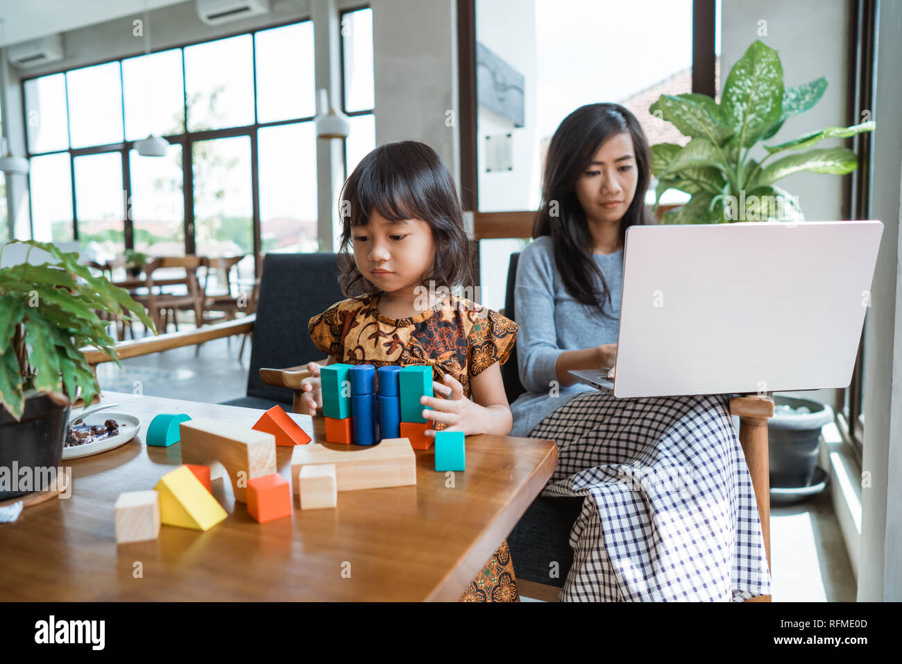 working mother with her child Stock Photo - Alamy