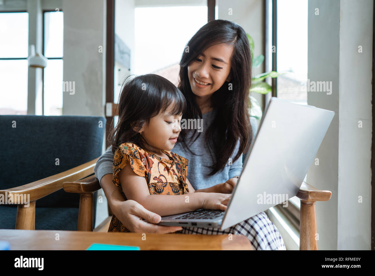 working mother with her child Stock Photo - Alamy