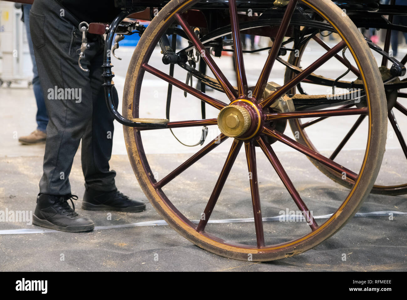 A man with next to traditional carriage waits for tourists in the old ...