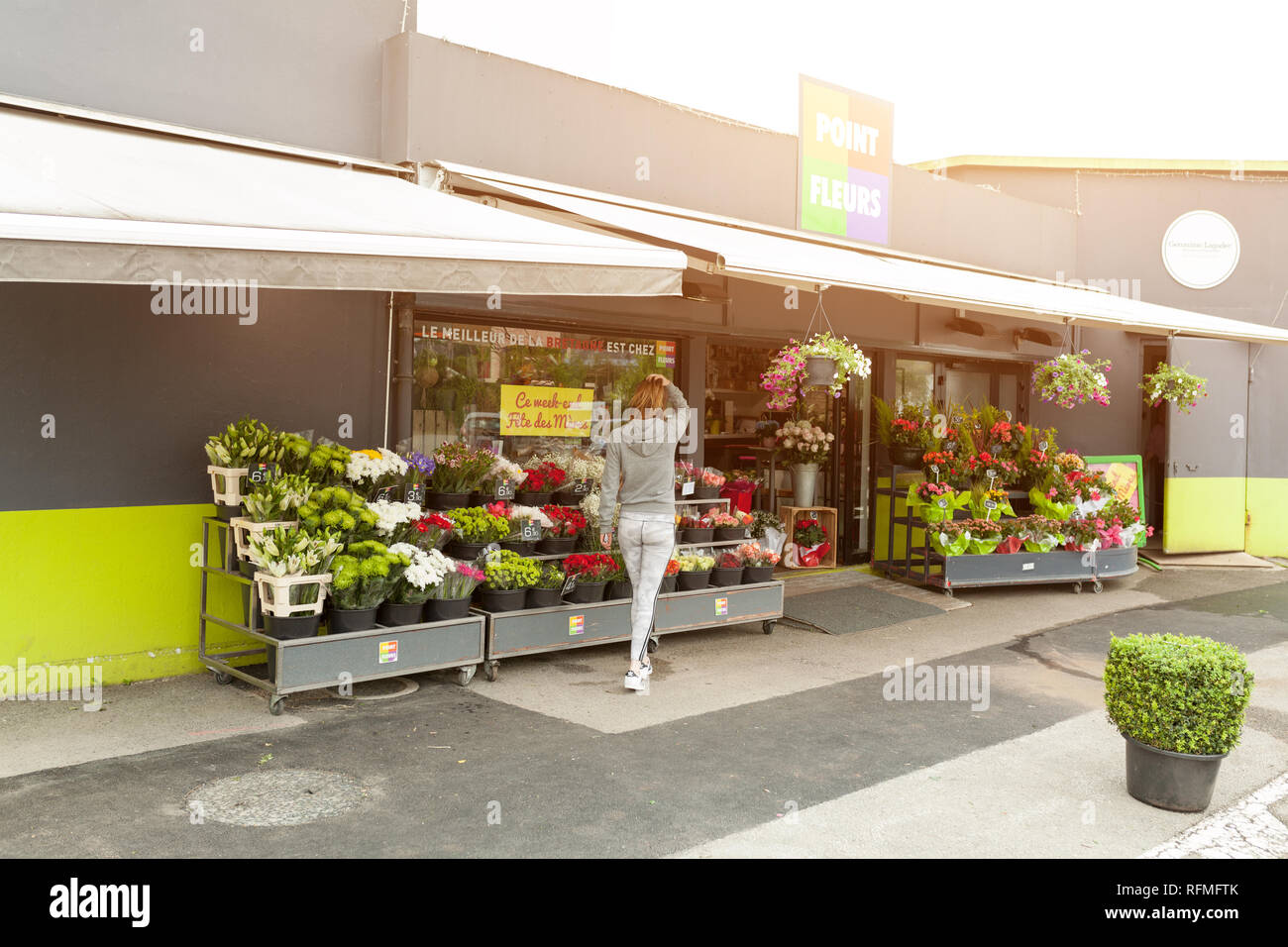 Brest, France 28 May 2018 An unrecognizable girl chooses flowers in a ...