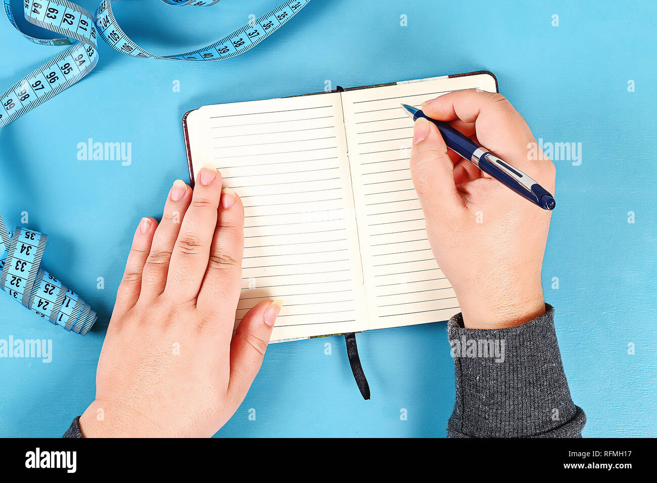 Healthy lifestyle concept with notepad. Weight loss or diet concept ...