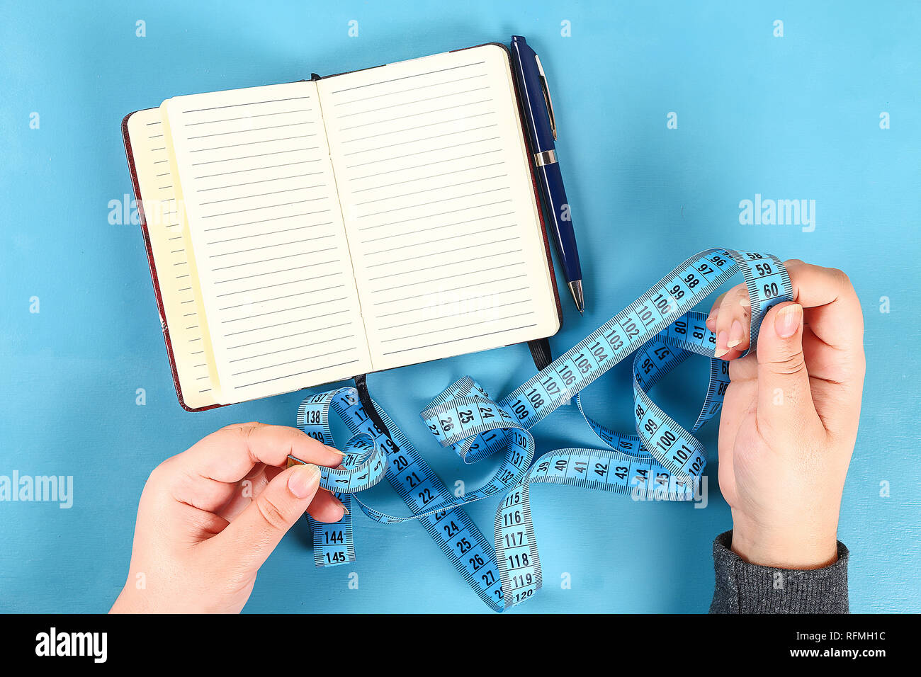 Healthy lifestyle concept with notepad. Weight loss or diet concept ...