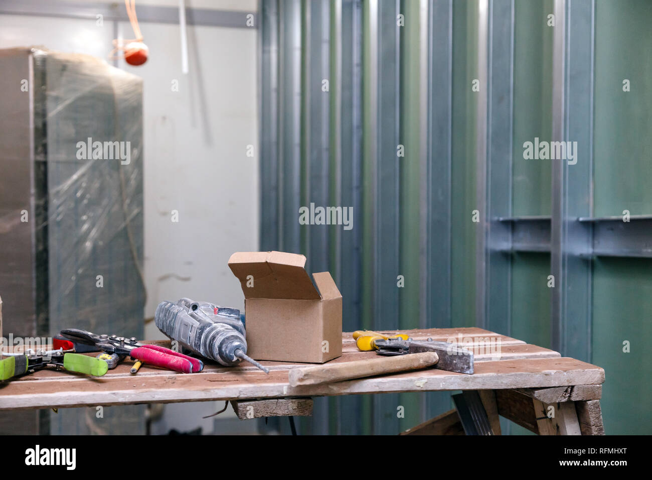 Closeup dusty construction building tools on the scaffolding, puncher ...