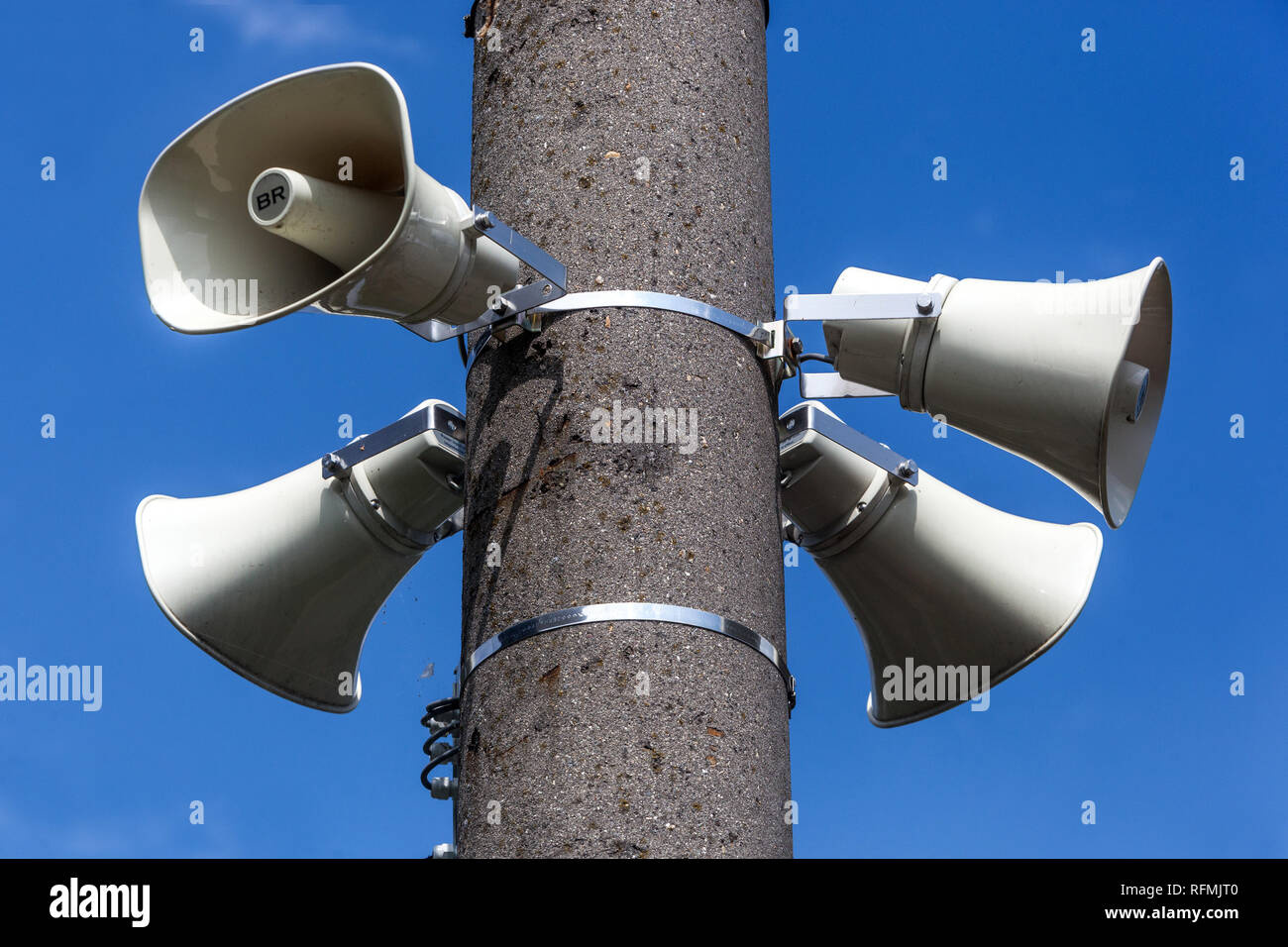 Four loudspeakers on the pole Stock Photo - Alamy