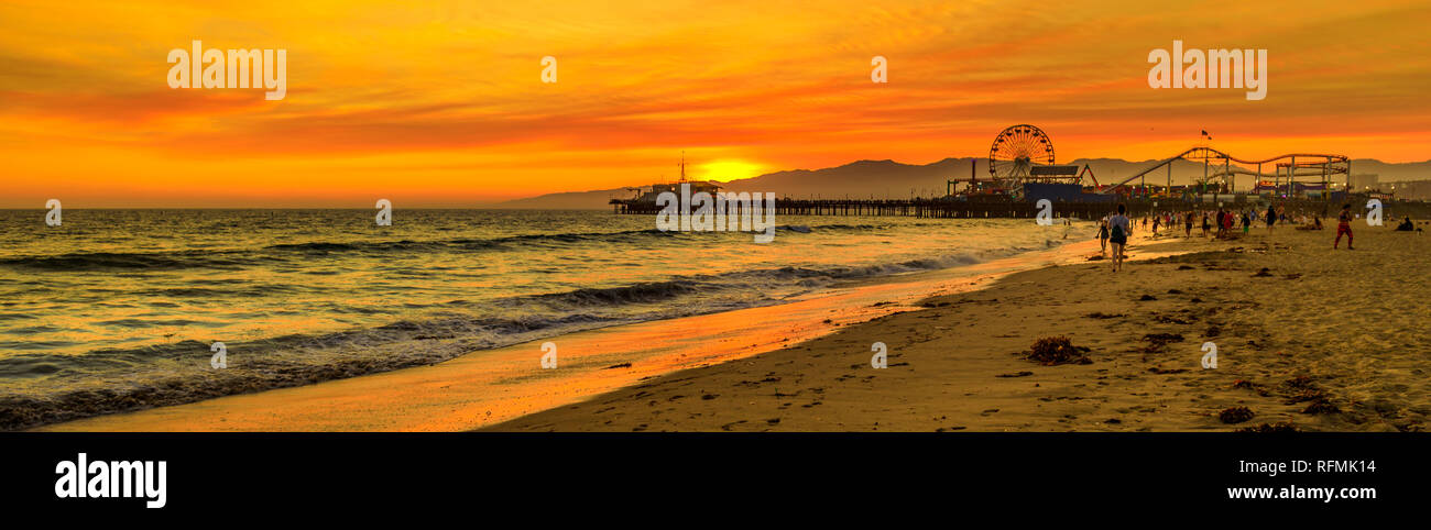 Scenic landscape of iconic Santa Monica Pier at orange sunset sky from ...