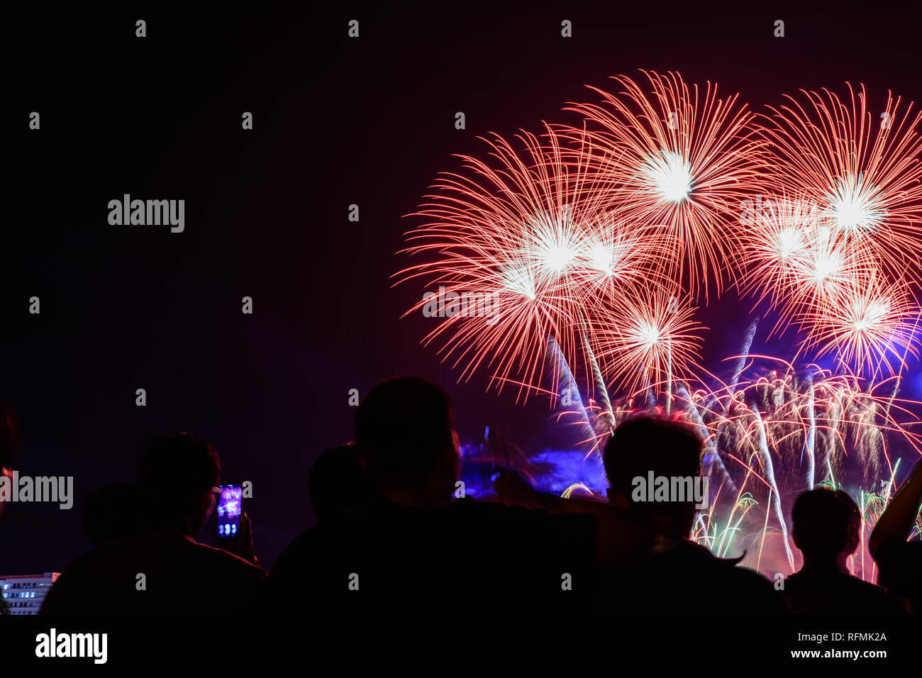 Crowd watching fireworks and celebrating city founded. Beautiful ...