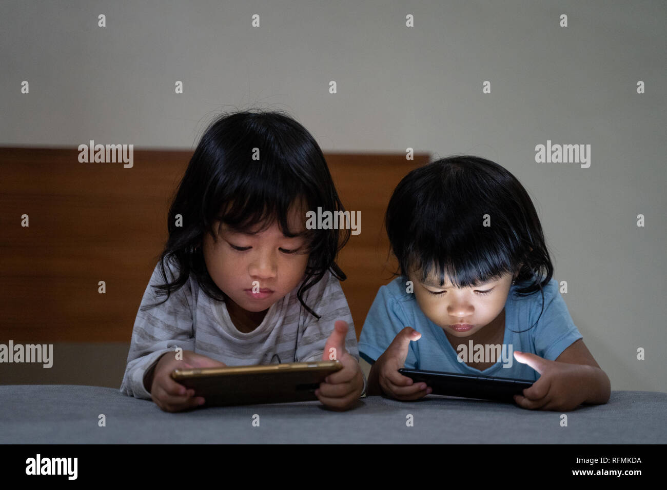 Asian kids playing video game hi-res stock photography and images - Alamy