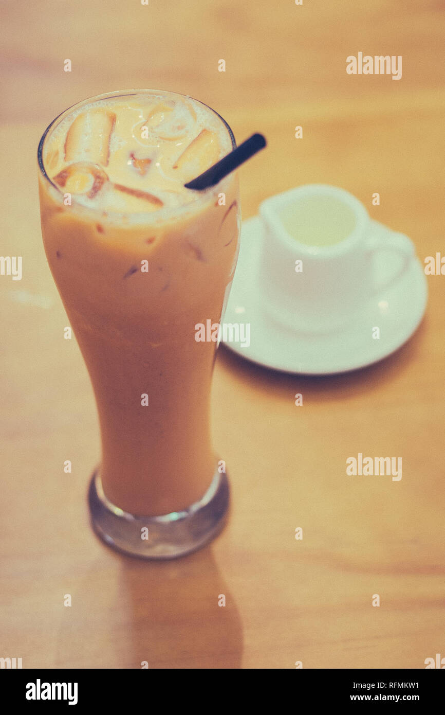 Thai Iced Milk Tea with sugar syrup on the side Stock Photo - Alamy