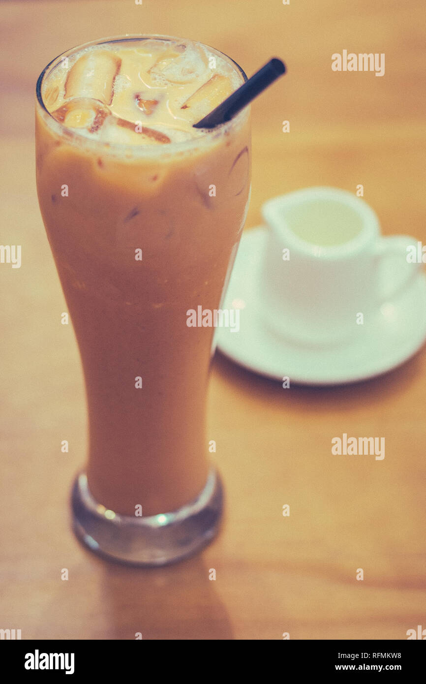 Thai Iced Milk Tea with sugar syrup on the side Stock Photo - Alamy